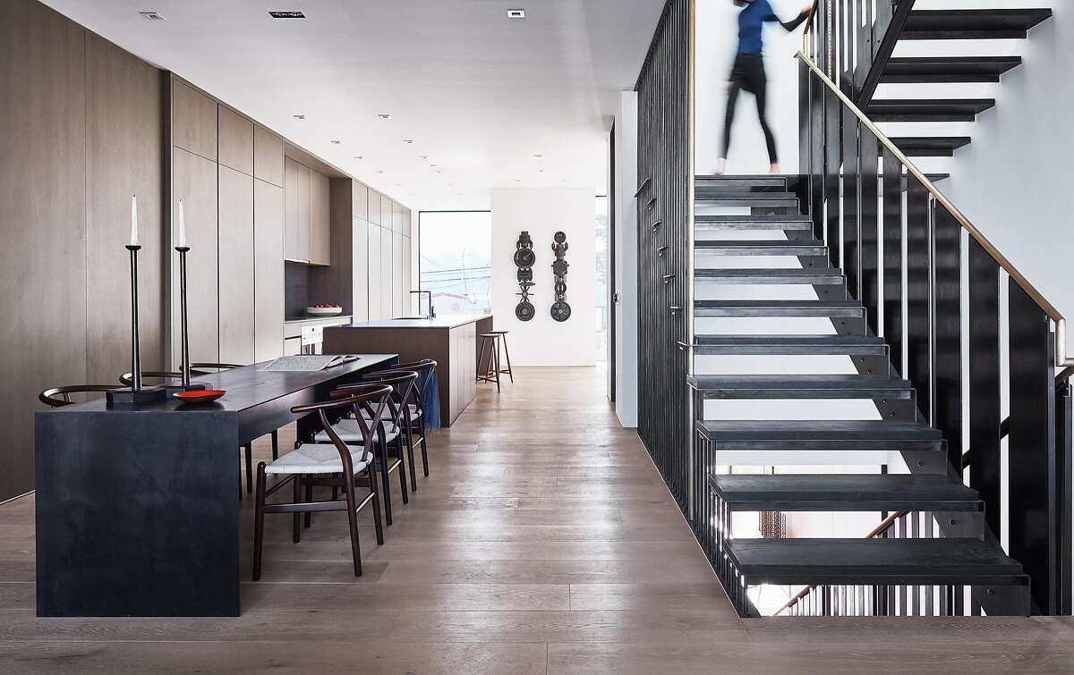 Architectural staircase connects all three levels of Noe Valley modern