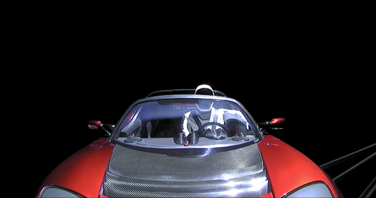 Space sports car is racing toward the asteroid belt