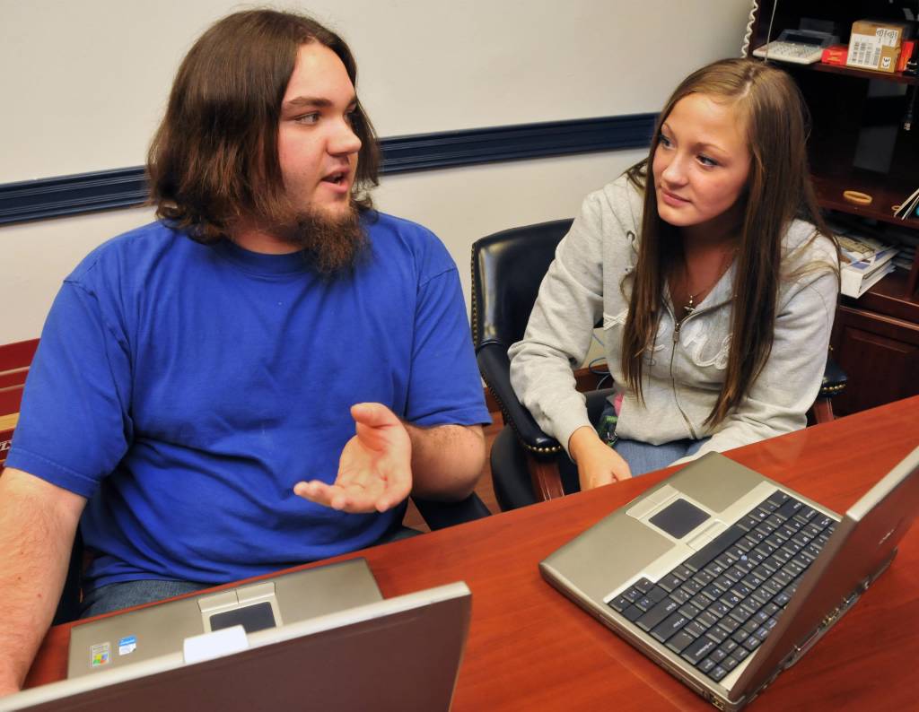 Agency awards laptops to college-bound kids