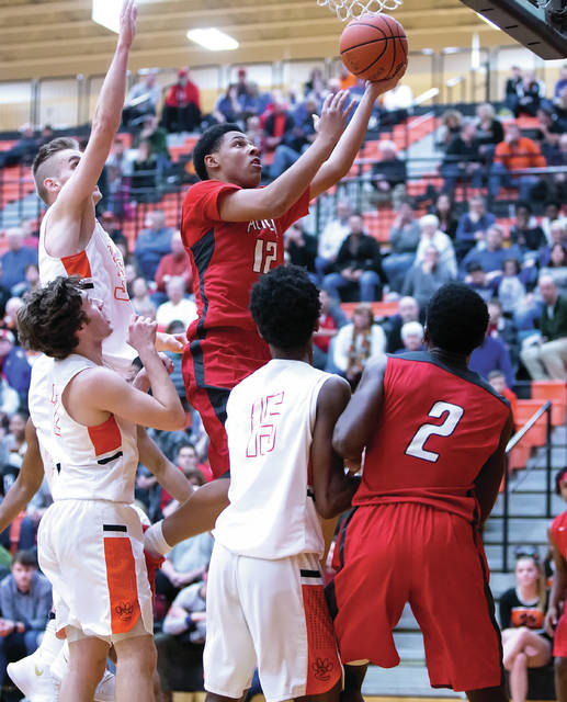 PREP BOYS BASKETBALL: Redbirds get OT win at East Tourney