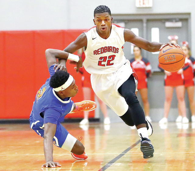 PREP BASKETBALL: Flyers’ 17-0 run propels them past Alton