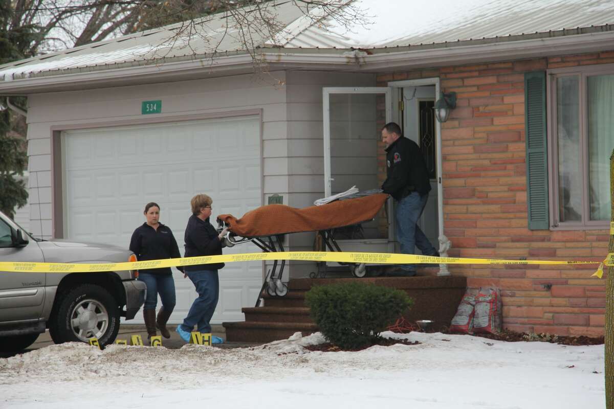 Authorities remove bodies from the scene of Sebewaing shooting
