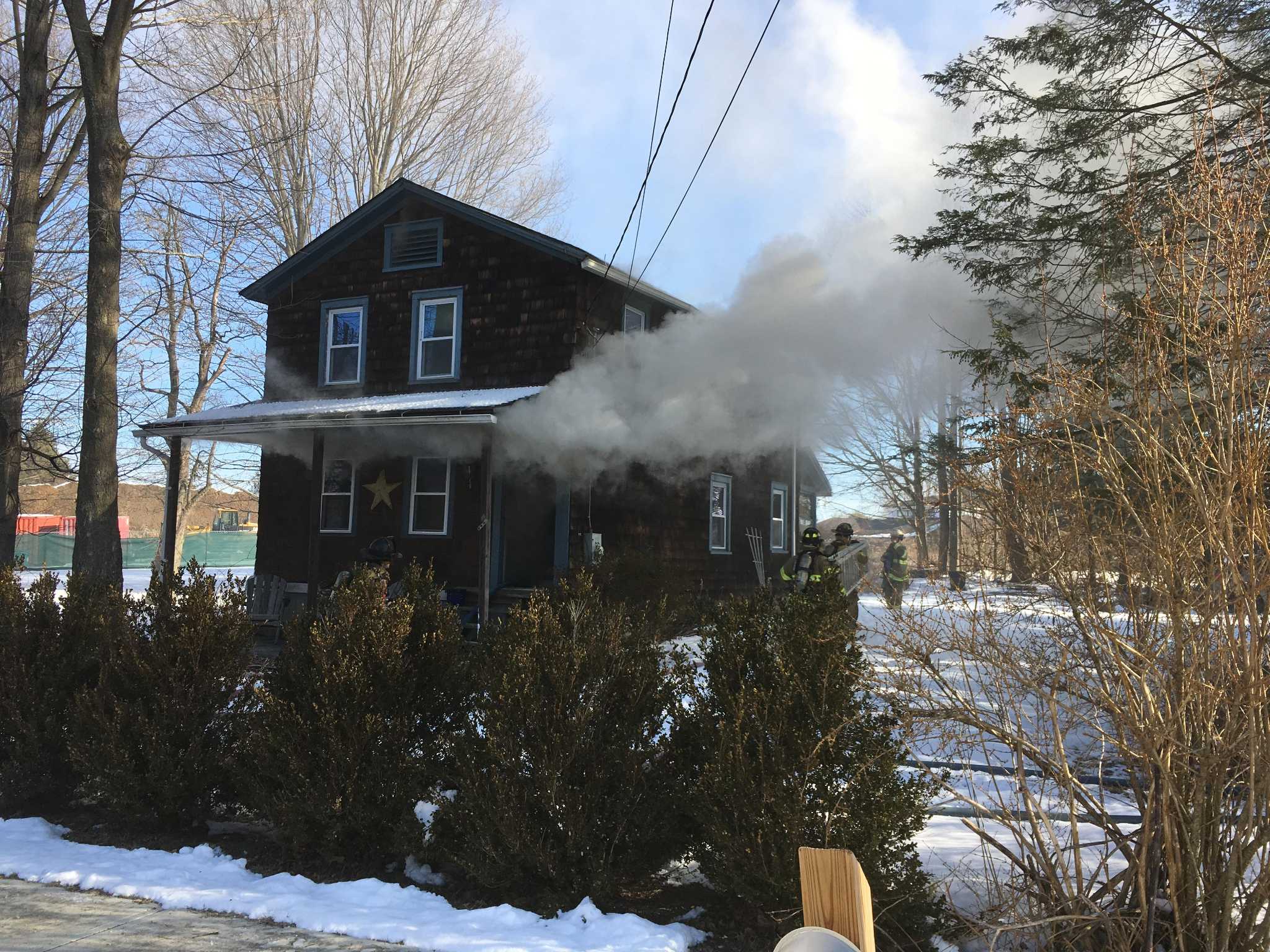 Two escape fire in historic Bethel home, but cat dies