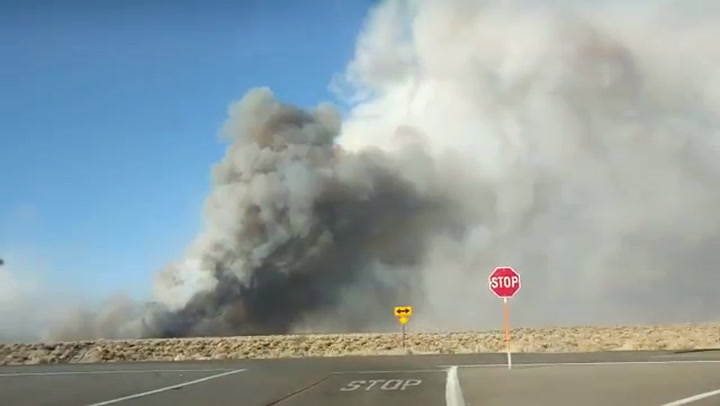 Wind-driven wildfire forces people to flee rural California