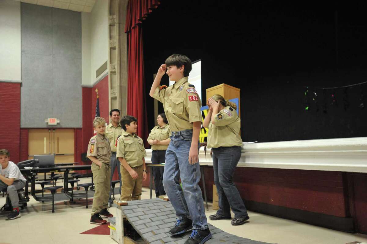Winsted Cub Scouts graduate to become Boy Scouts as parents look on ...