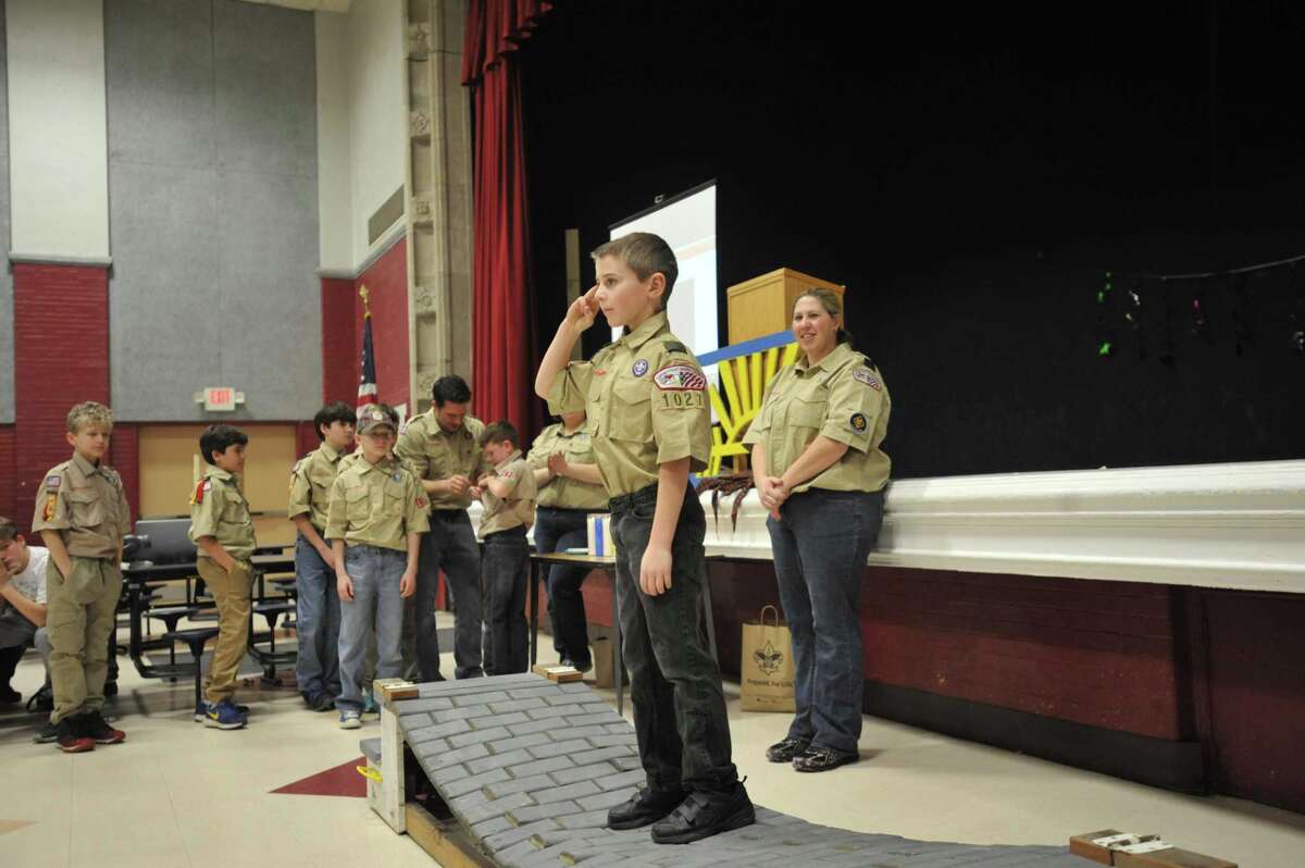 Winsted Cub Scouts graduate to become Boy Scouts as parents look on ...