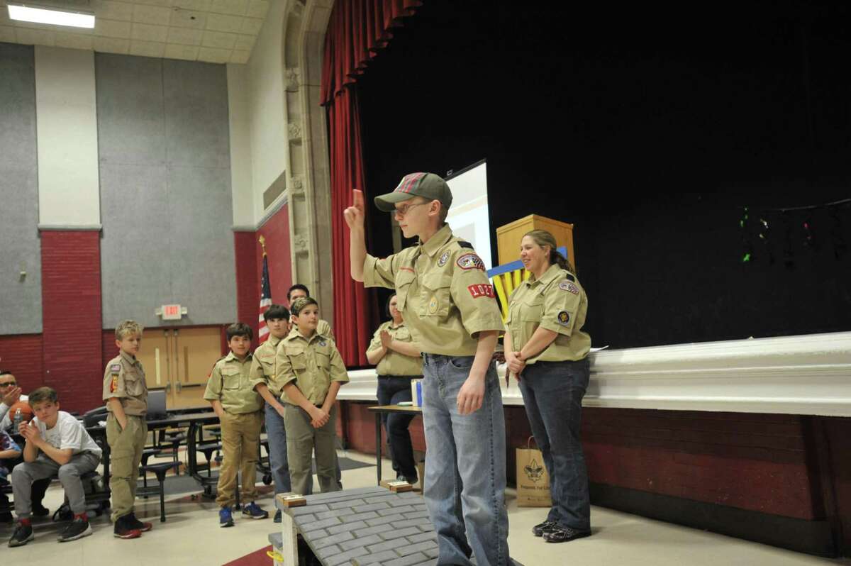 Winsted Cub Scouts graduate to become Boy Scouts as parents look on ...