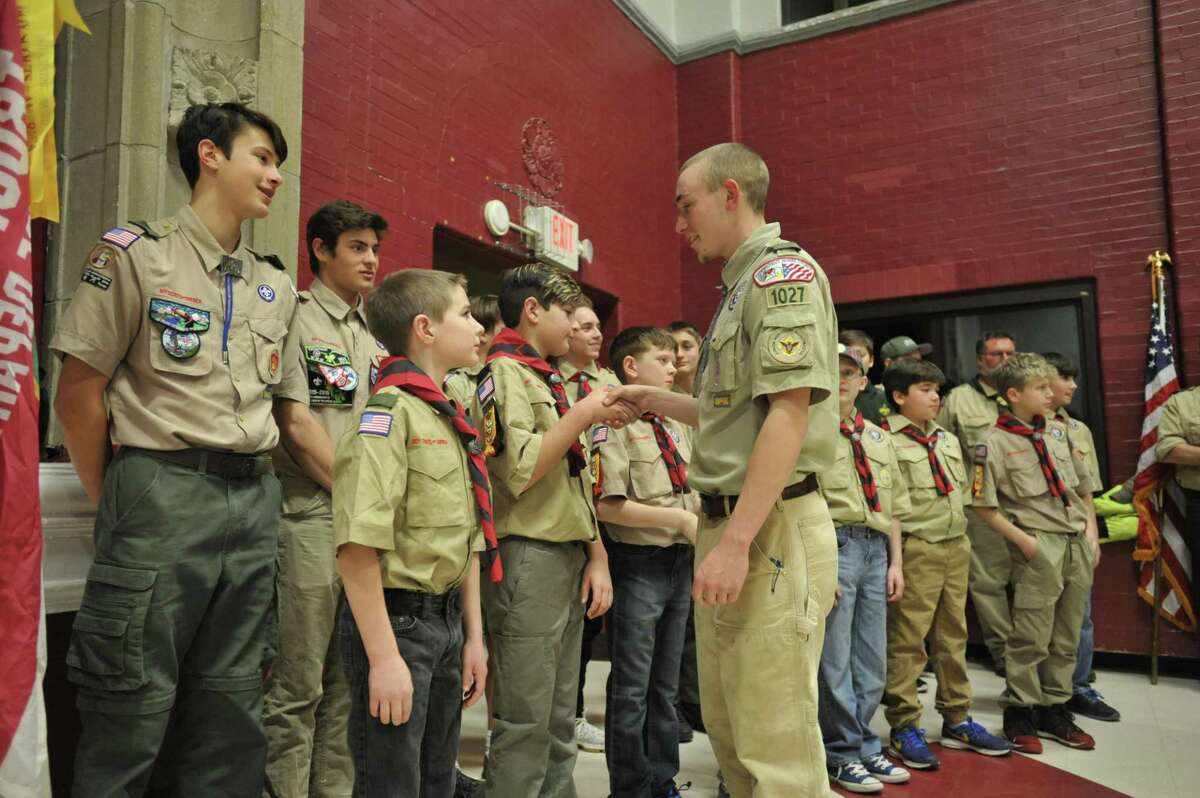 Winsted Cub Scouts graduate to become Boy Scouts as parents look on ...