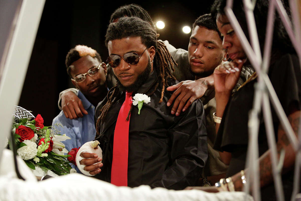 Hundreds attend the funeral of local rap artist Chris Polk