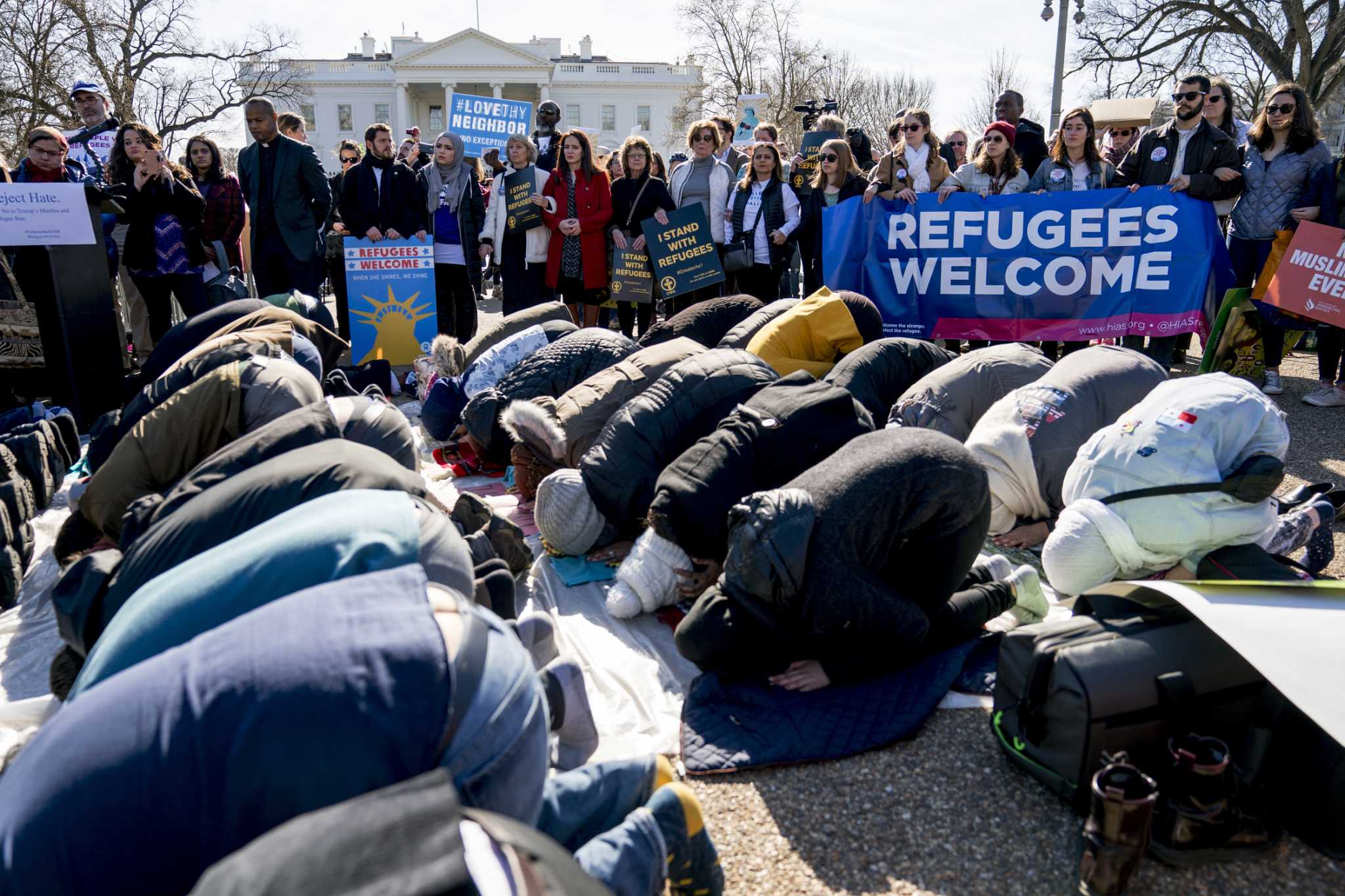 Refugee groups fight Trump travel ban - and for their own survival