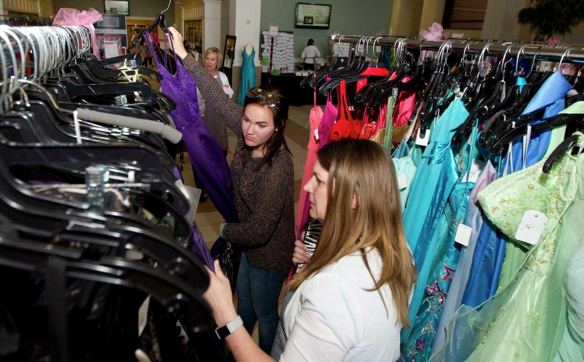 High school girls finding perfect prom dress at Priceless Gowns