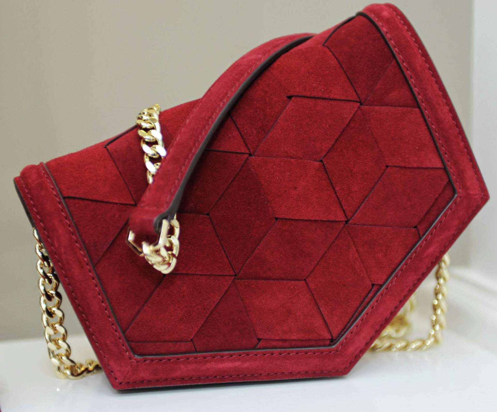 China ‘sneak peeks’ dealing aces for Norwalk bag designer