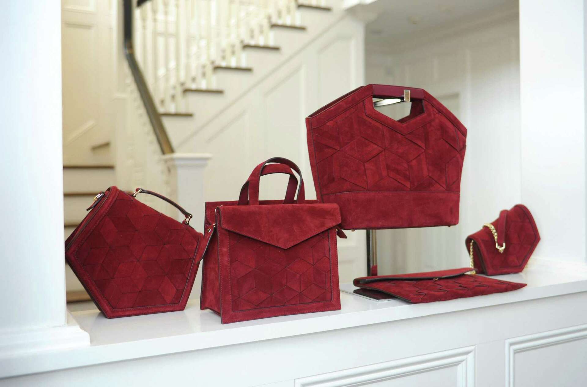 China ‘sneak peeks’ dealing aces for Norwalk bag designer