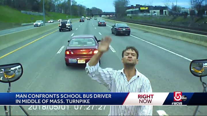 Video shows man jumping on school bus on Mass Pike