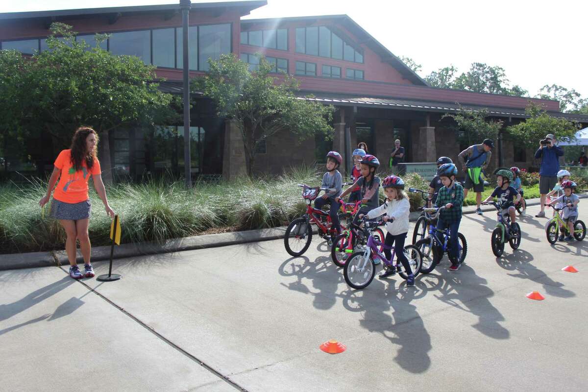 Children get safety tips during Kids Bike Rodeo in The Woodlands