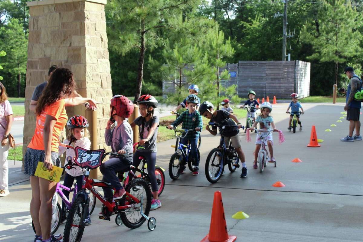 Children get safety tips during Kids Bike Rodeo in The Woodlands