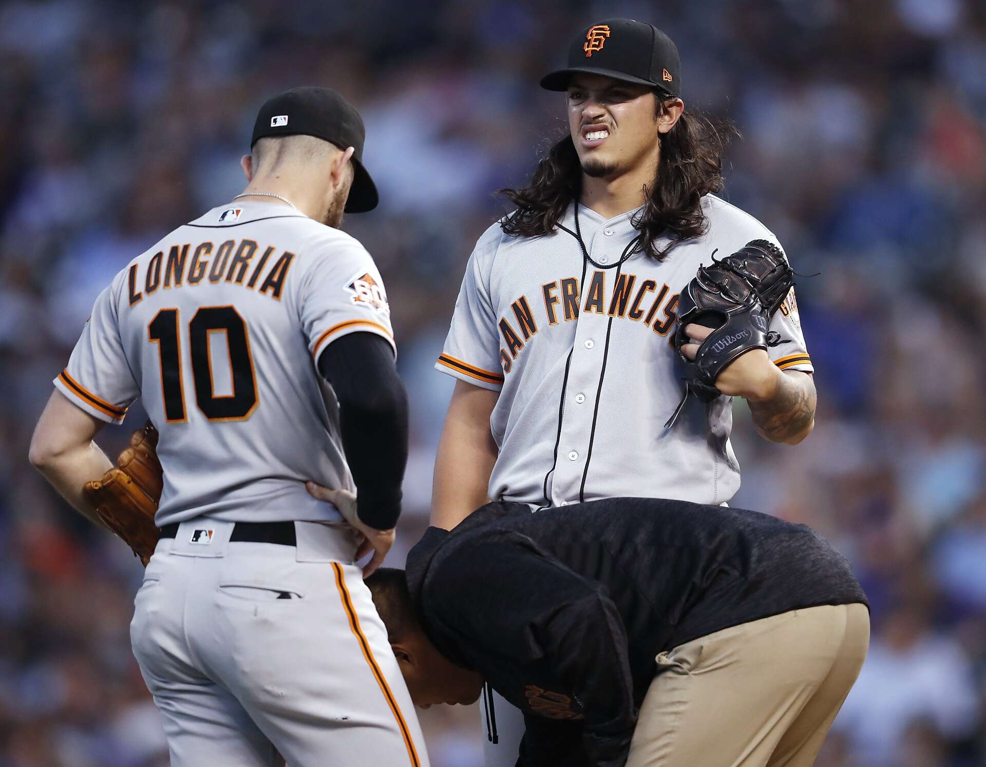 Giants lose two pitchers to injuries, fall again to Rockies