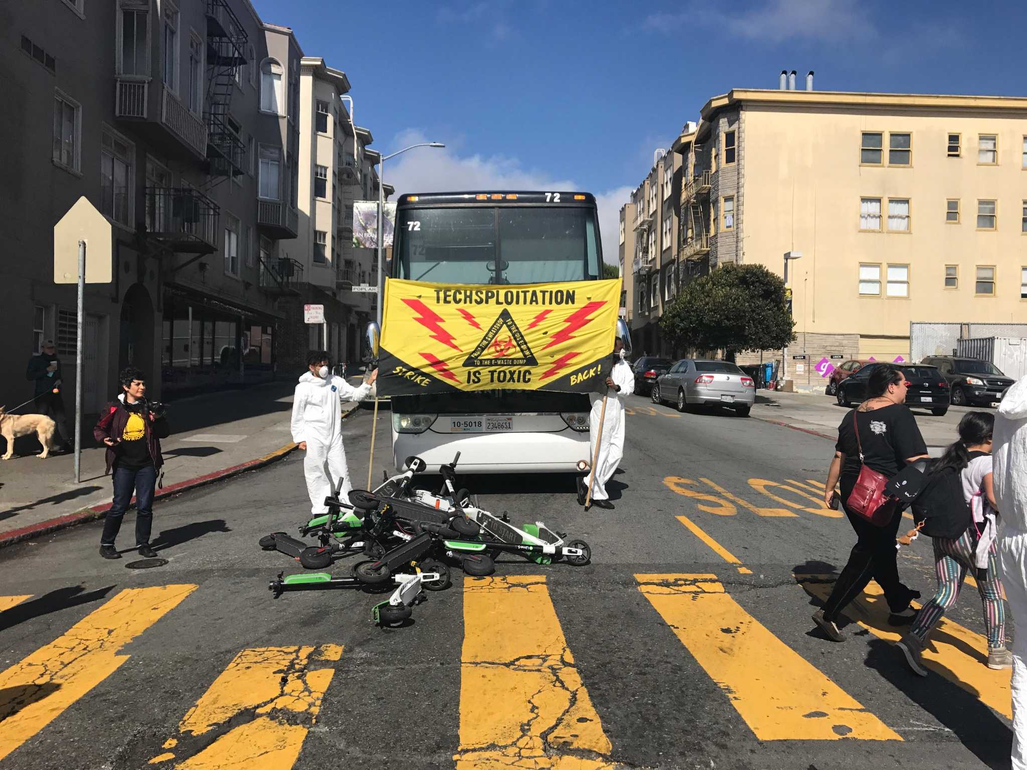Protesters toss scooters into street to block tech buses in SF