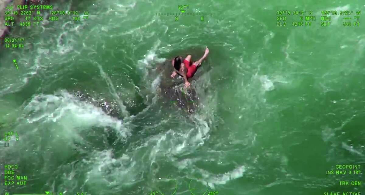 Incredible video shows rescue of man stuck between two massive ...
