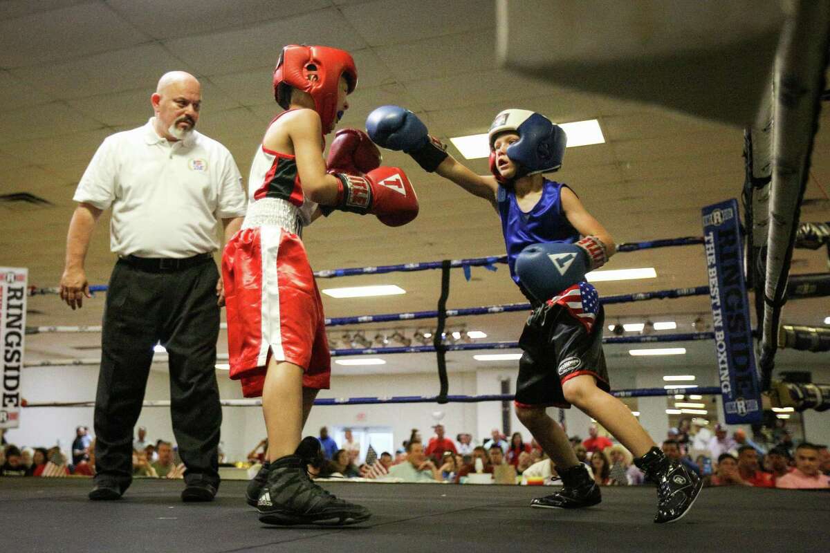 First responders touch gloves for nonprofit Fearless Boxing Gym