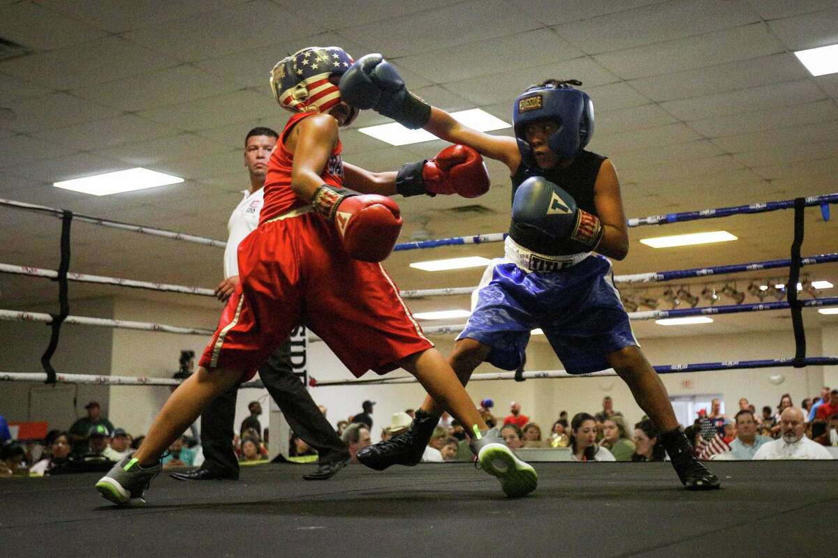 First responders touch gloves for nonprofit Fearless Boxing Gym