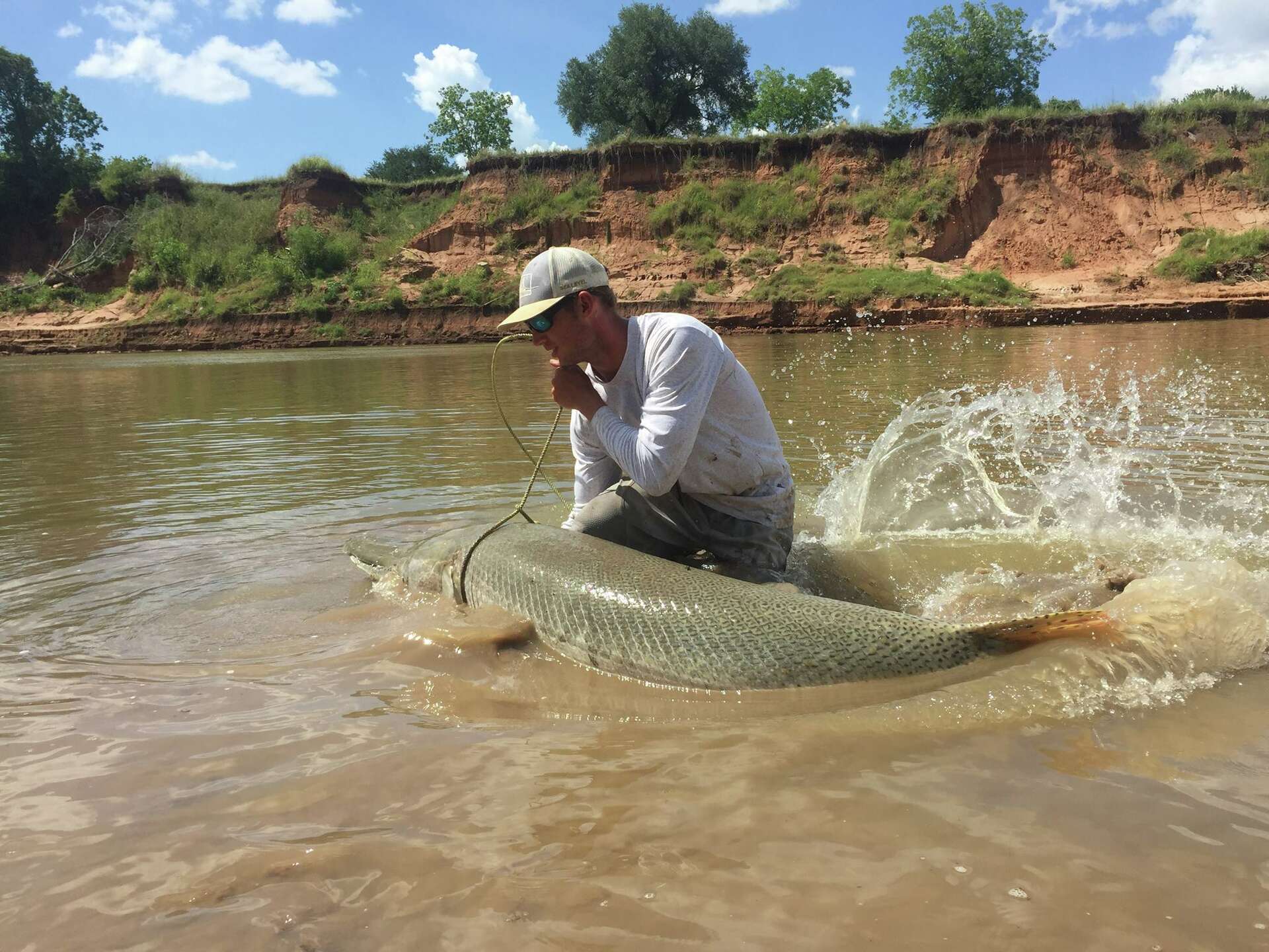 Texas' own 'Fish Whisperer' catches an 8-foot alligator gar in the ...