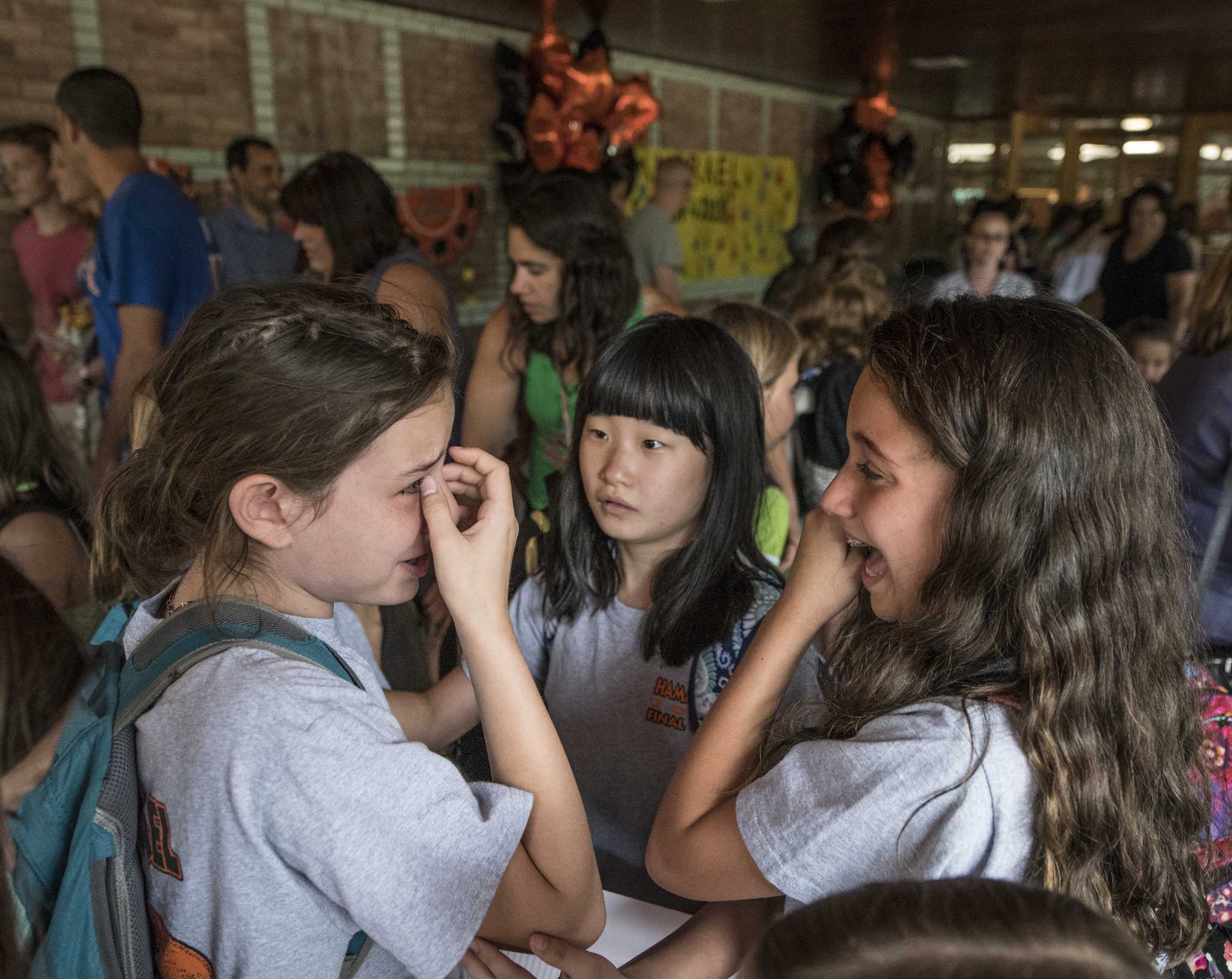 Photos: Tears, hugs as elementary students move on up