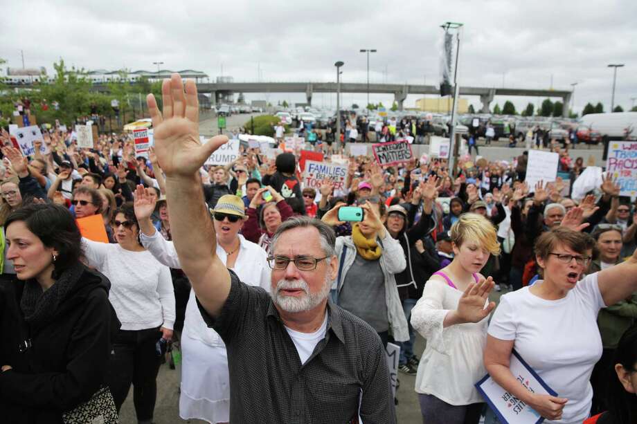 Connelly: 10,000 rally, register, write letters at feds' SeaTac ...