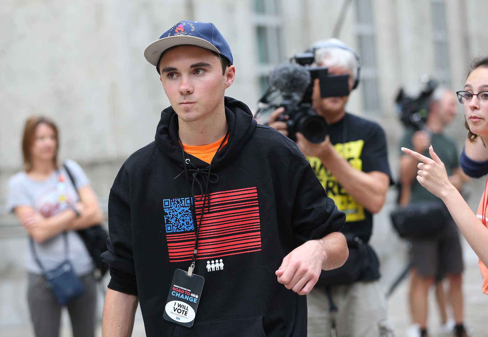 Rally seeks to prevent gun violence while police keep foes away