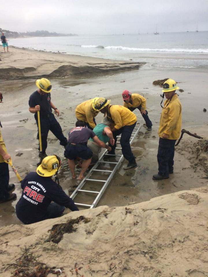 Woman trapped in quicksand on Calif. beach. Then her rescuers get stuck ...
