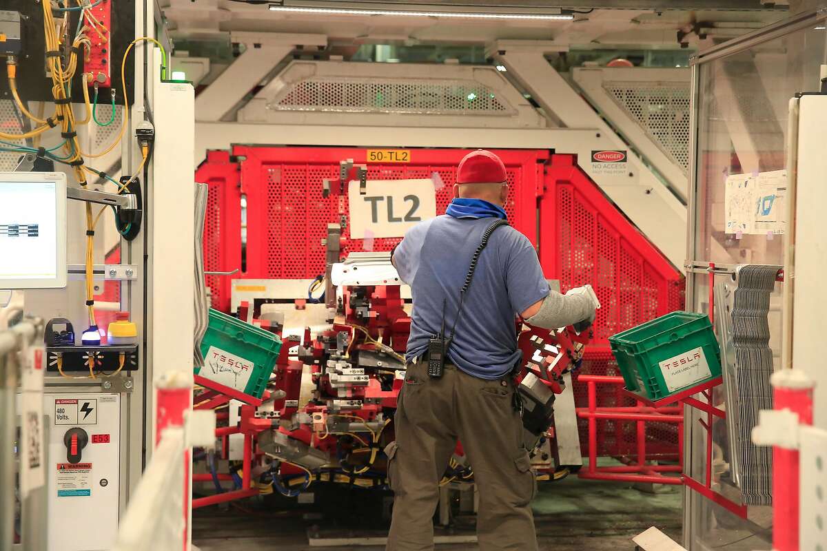 Touring Tesla’s Model 3 production line, ‘the machine to build the machine’