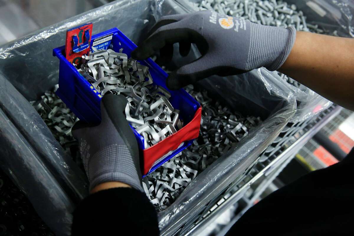 Touring Tesla’s Model 3 production line, ‘the machine to build the machine’