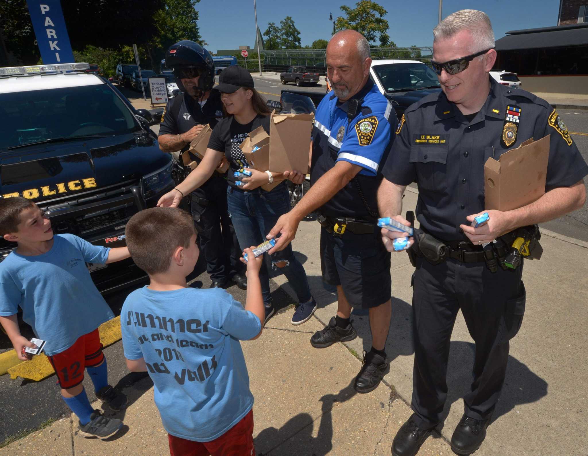 Cops pass out ice cream to campers