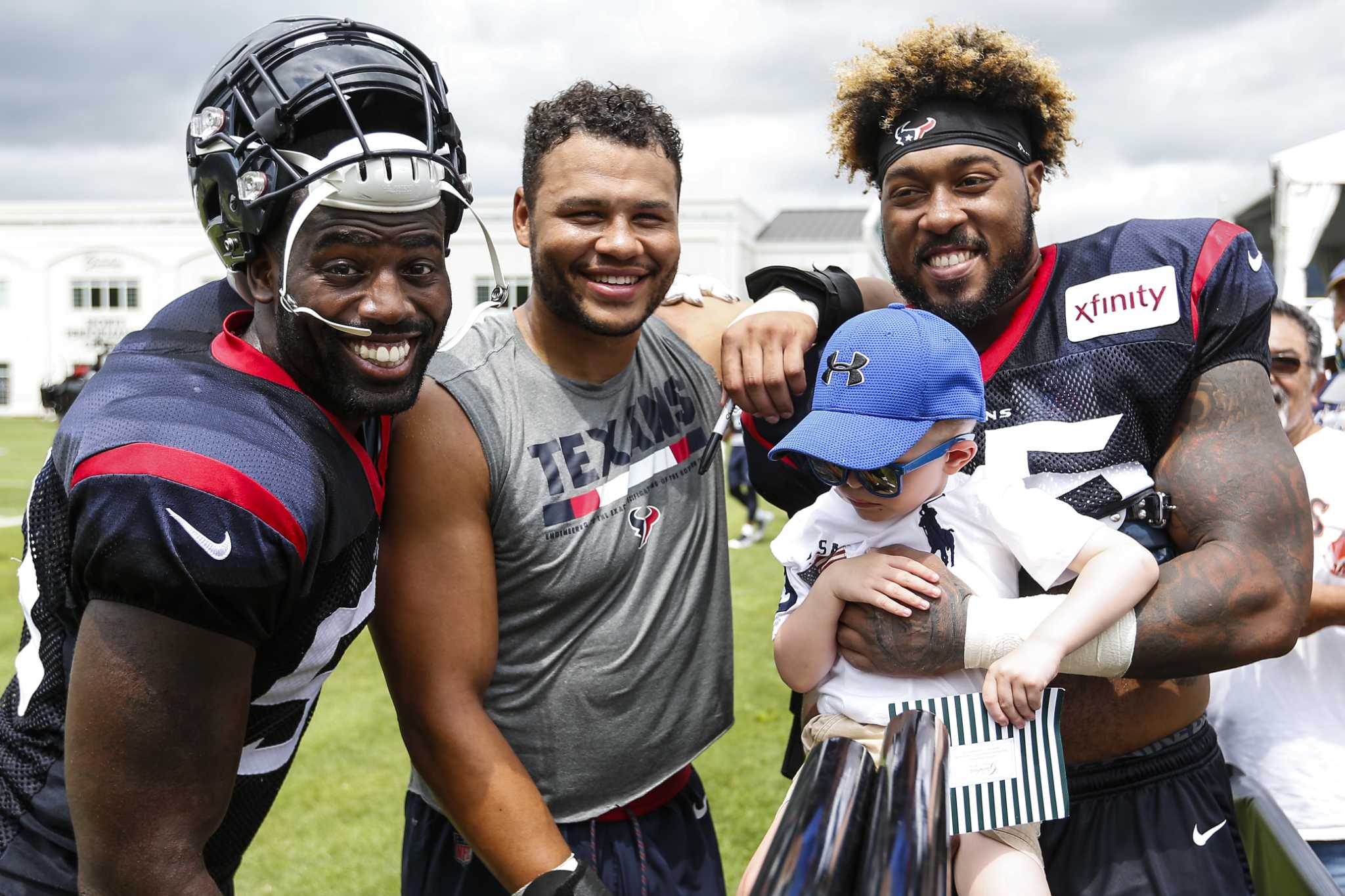 Child finds out he's cancer free as he meets Texans players