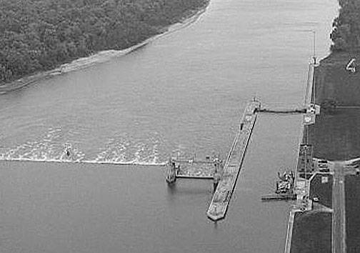 Congressmen looking at lock and dam