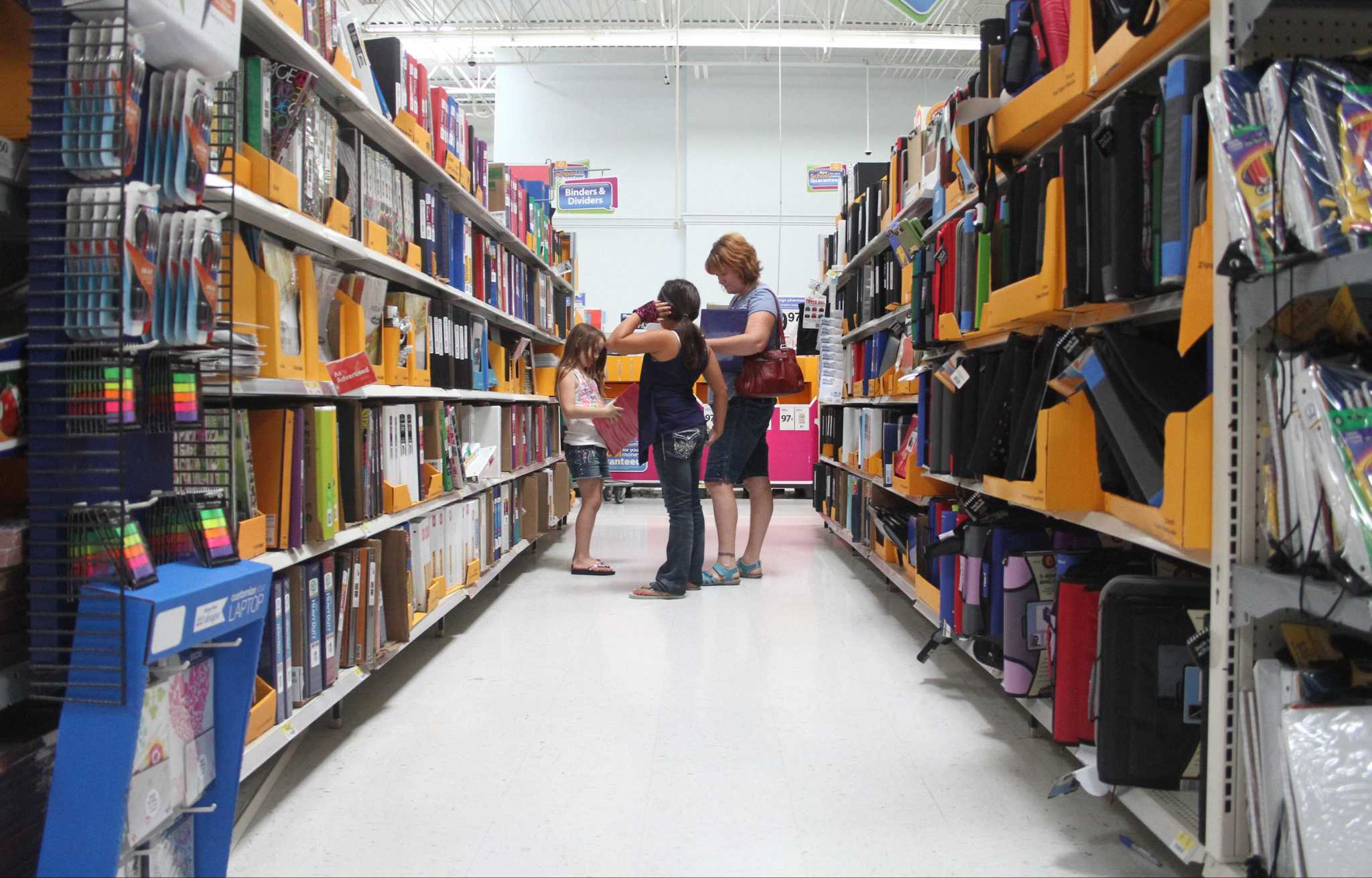 Walmart sees sales rise at stores and online, raises outlook