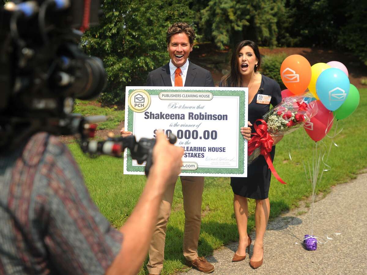 Milford woman gets surprise visit, check from Publishers Clearing House