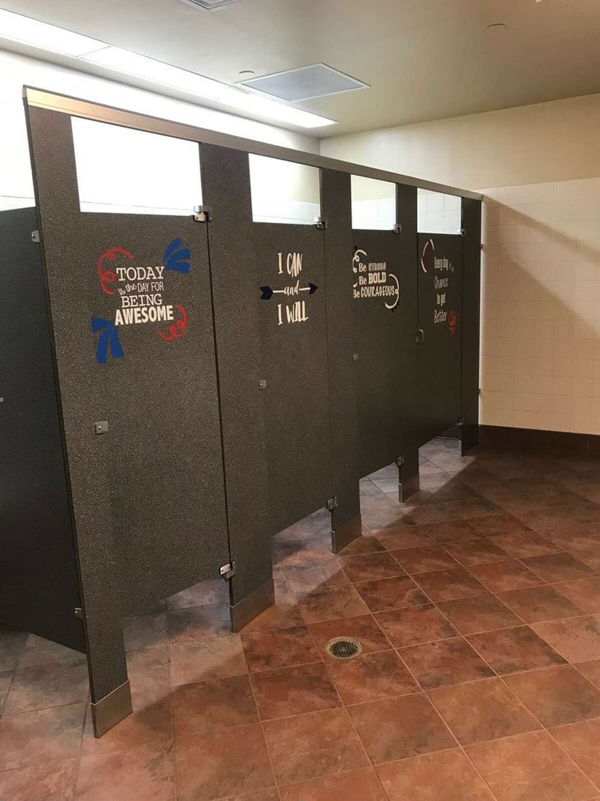 Photos: Groves school adds inspiration to restroom stalls