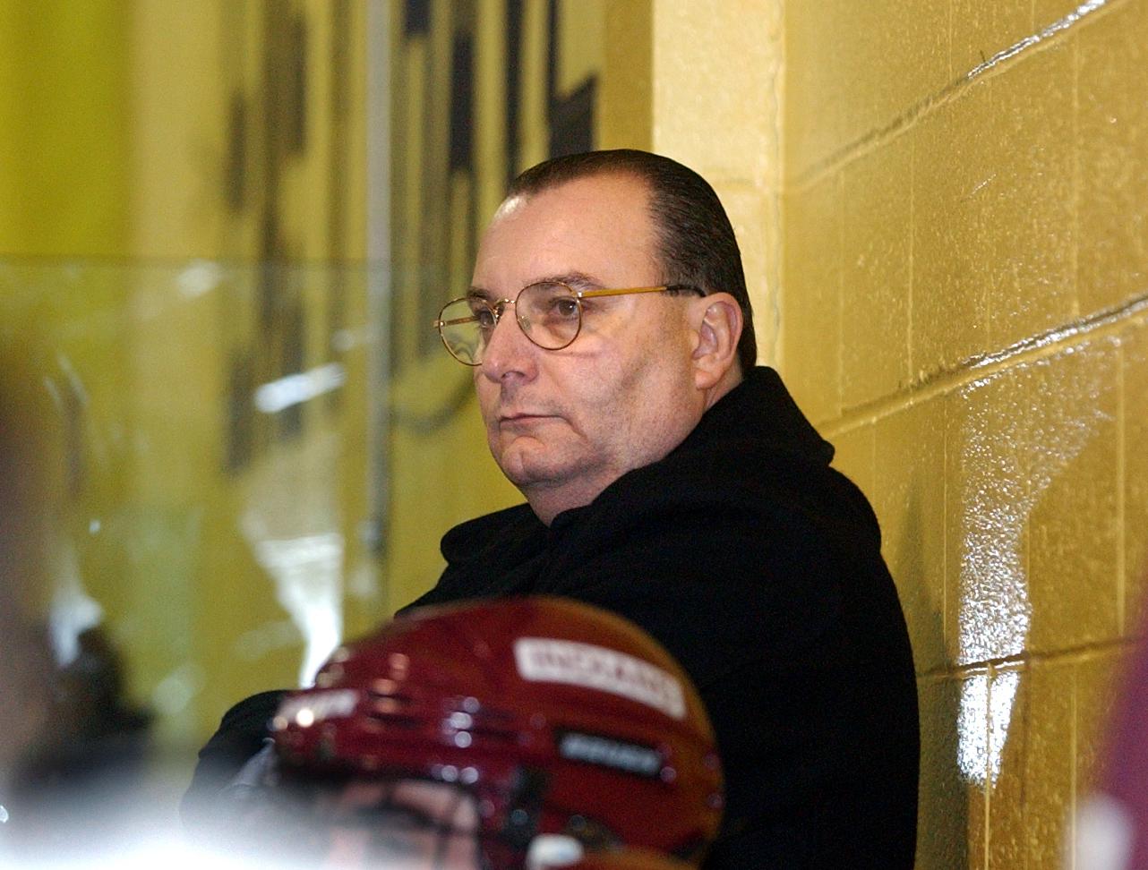 Milford school system retracts firing of high school hockey coach