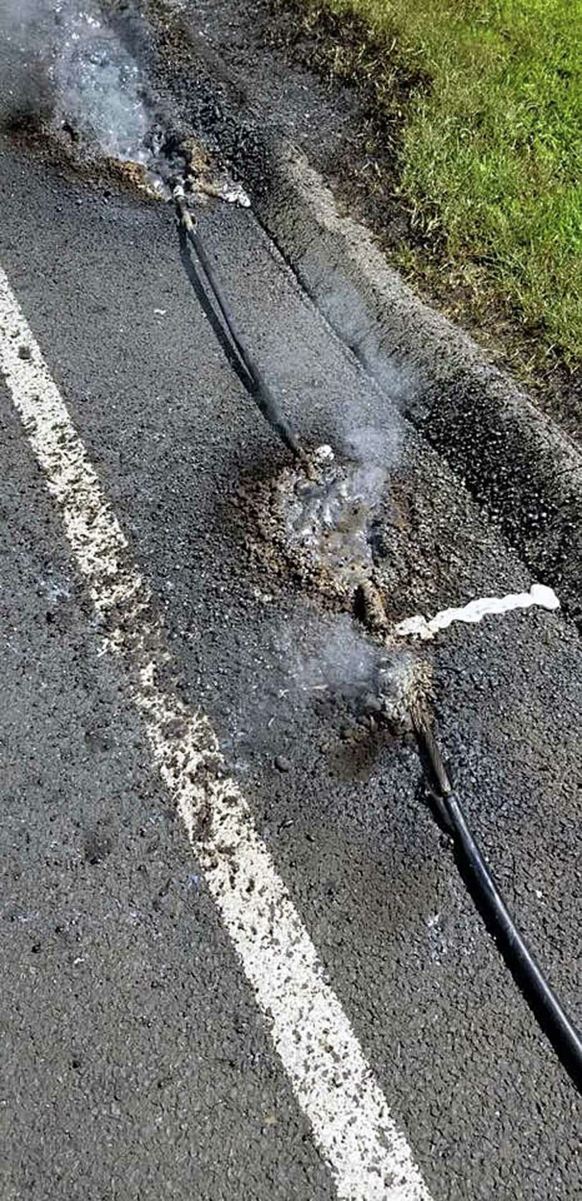 Power line burned through asphalt in Westport