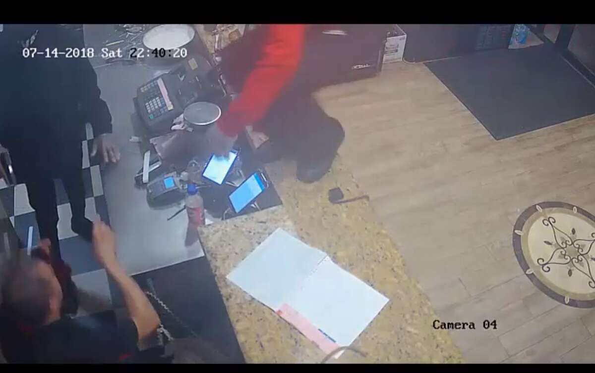 Armed suspects in violent pizza store robbery caught on camera