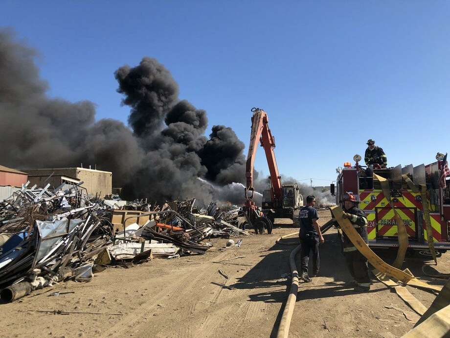Firefighters control fire at San Leandro metal yard, find Tesla in ...