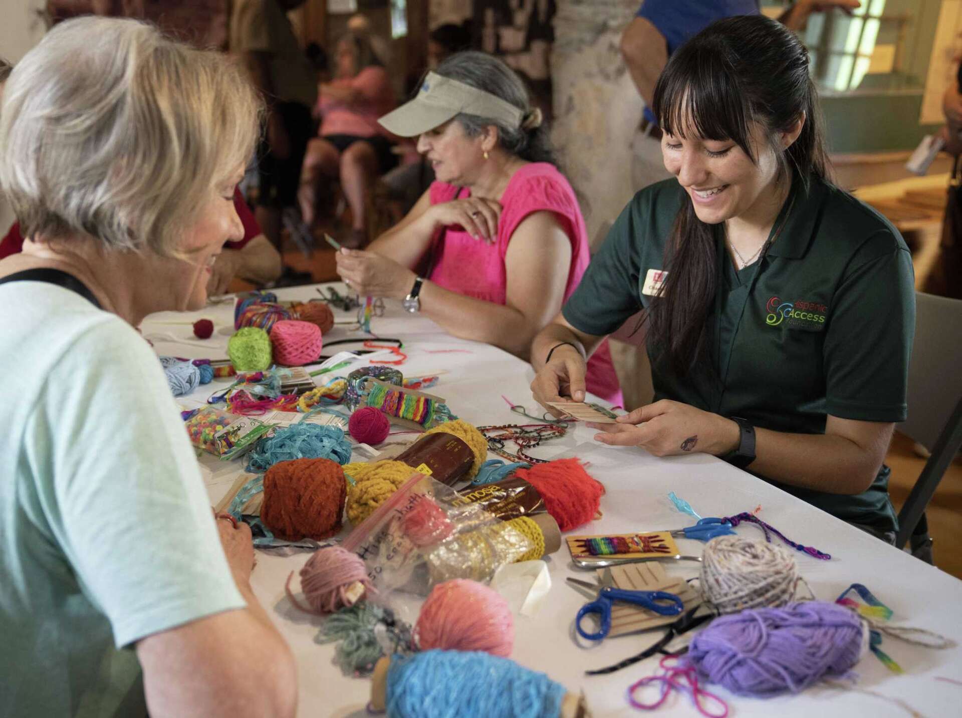 Visitors enjoy learning about hand weaving at San Antonio’s Mission Espada