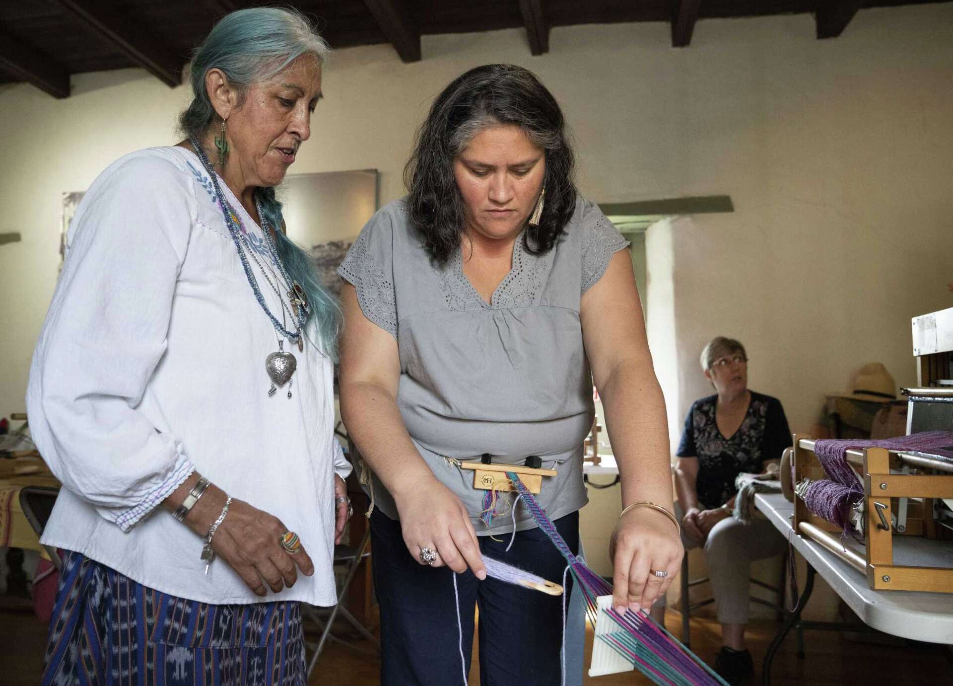 Visitors enjoy learning about hand weaving at San Antonio’s Mission Espada