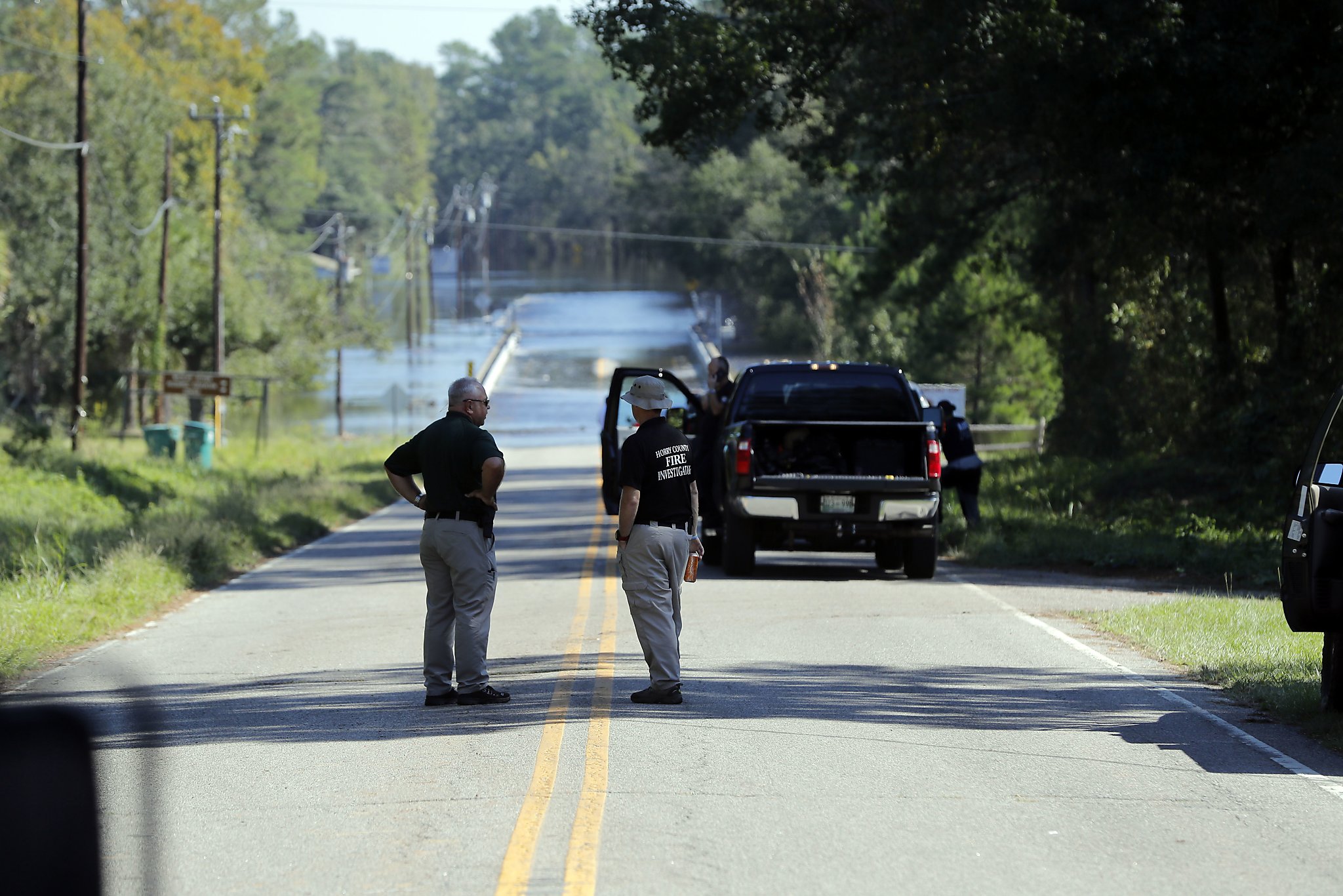 2 patients drown as van swept into floodwaters