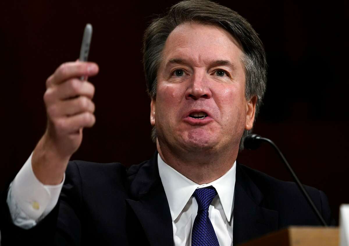 Poignant photo of women crying, scowling behind Kavanaugh goes viral