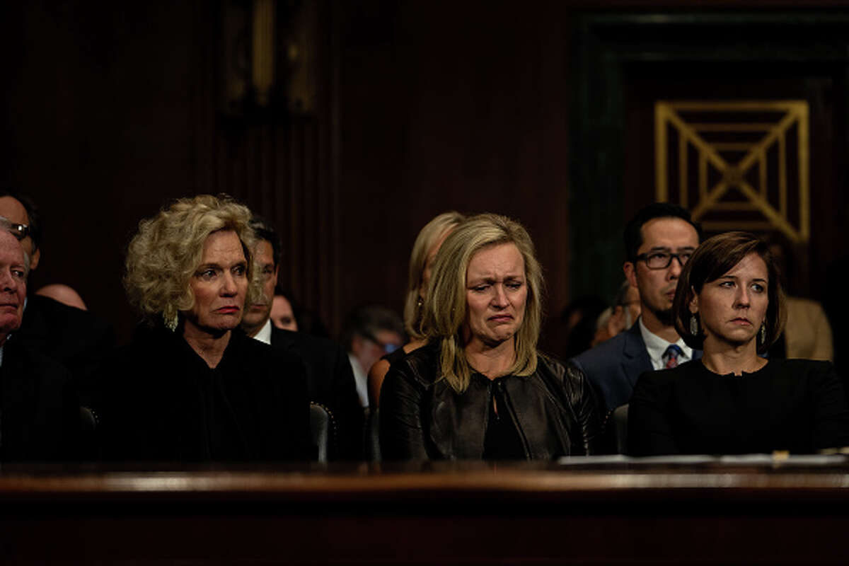 Poignant photo of women crying, scowling behind Kavanaugh goes viral