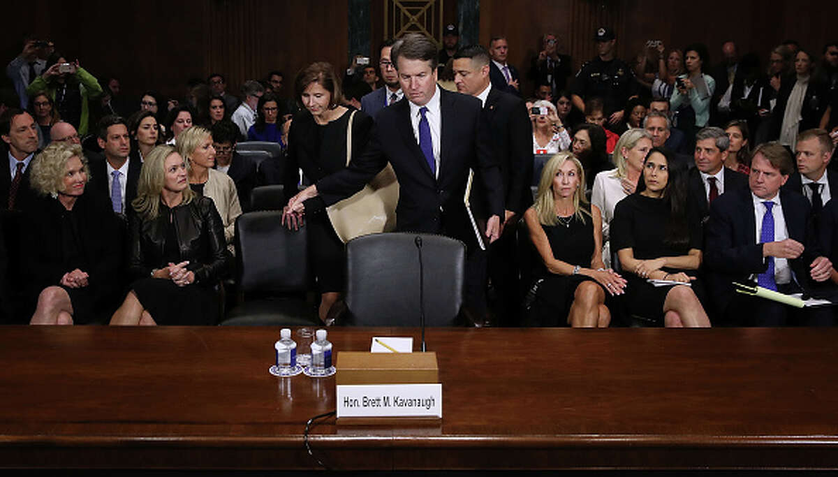 Poignant photo of women crying, scowling behind Kavanaugh goes viral