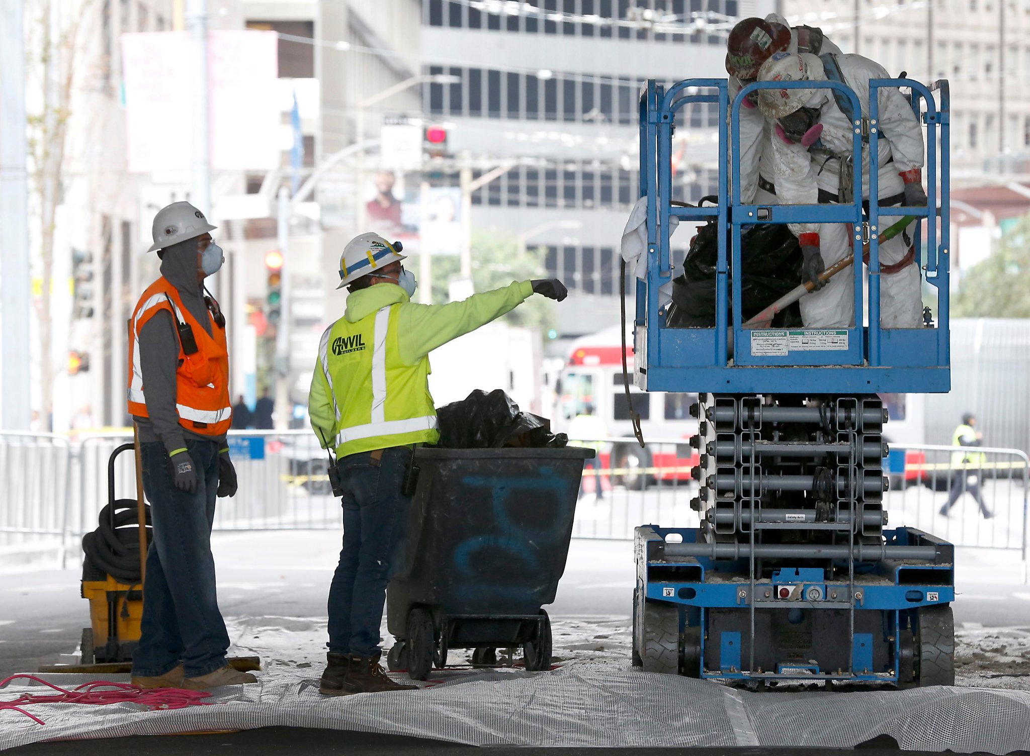 Workers at SF transit center prepare to add support column under ...
