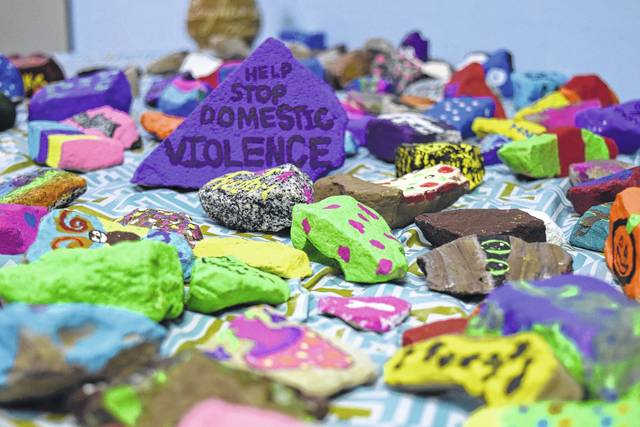 Rocks with a message: Colorful stones raising awareness about domestic ...